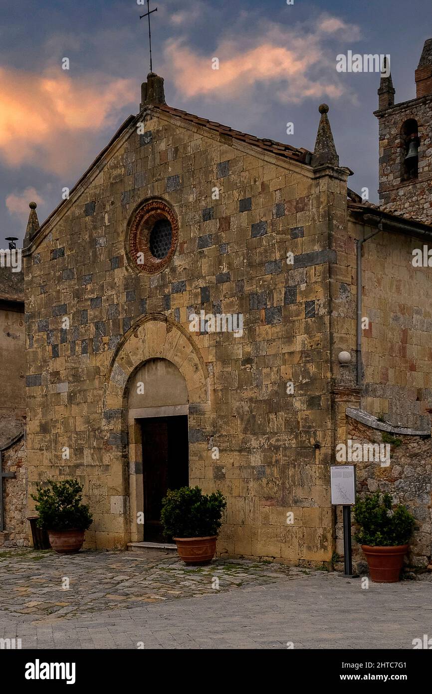 A round oculus rimmed by sculpted terracotta pierces the golden ...