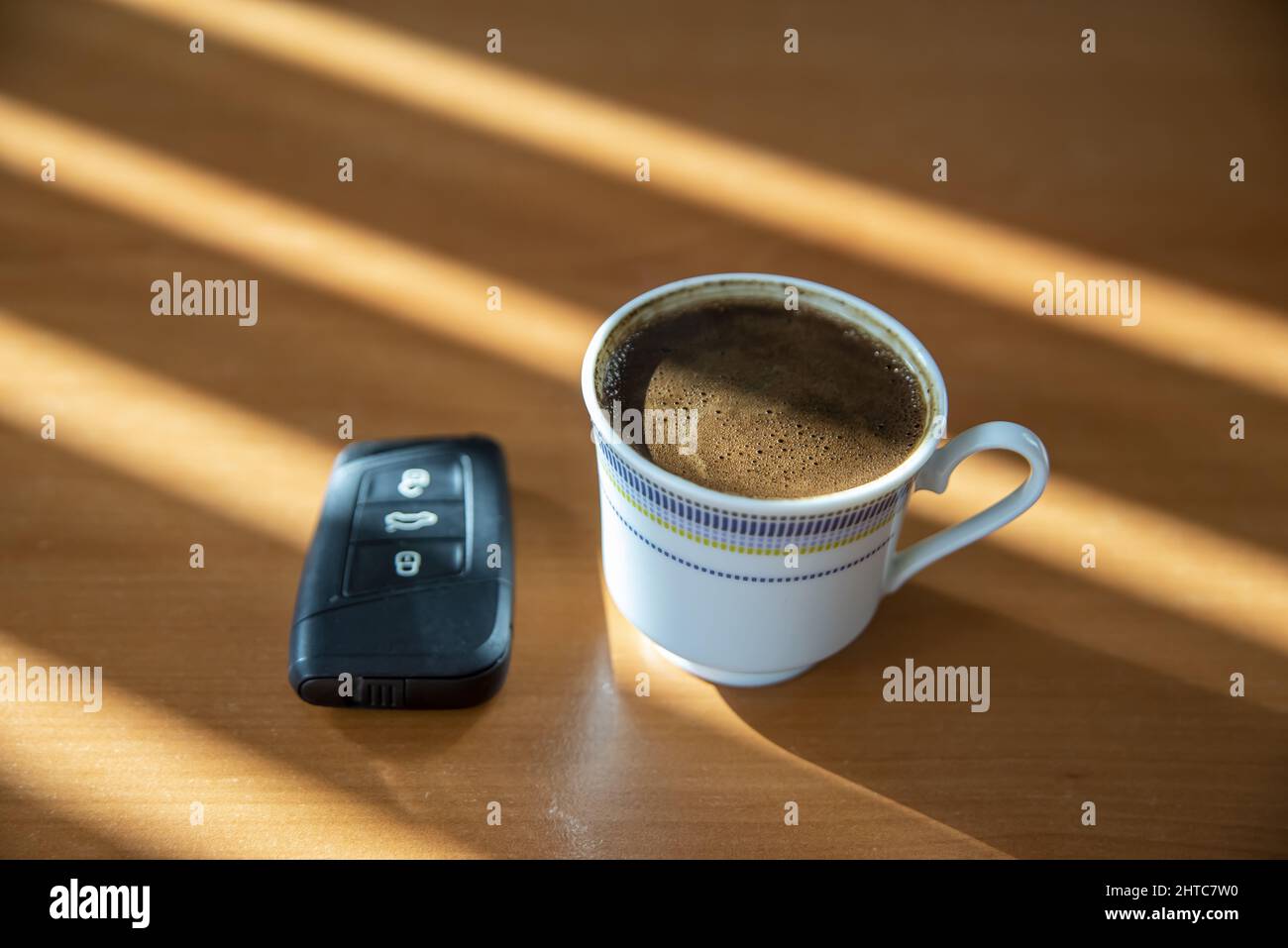 Turkish coffee cup and car key on wooden table with copy space Stock ...