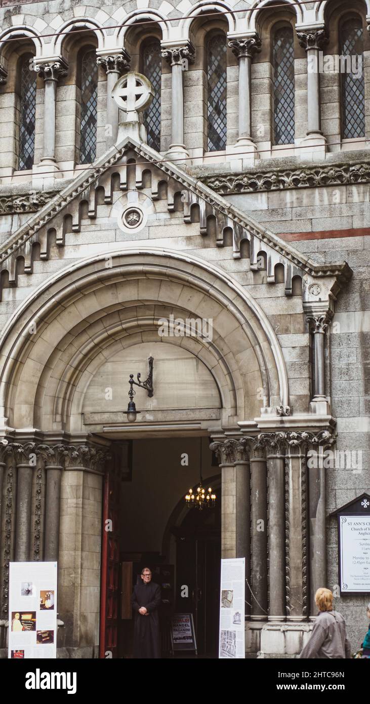 Priest waits in the doorway at St. Ann's Church Dublin, Ireland Dawson ...