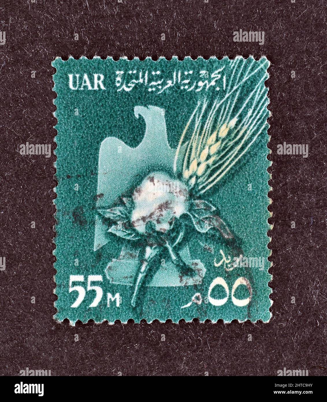 Cancelled postage stamp printed by Egypt, that shows Eagle, cotton and ...