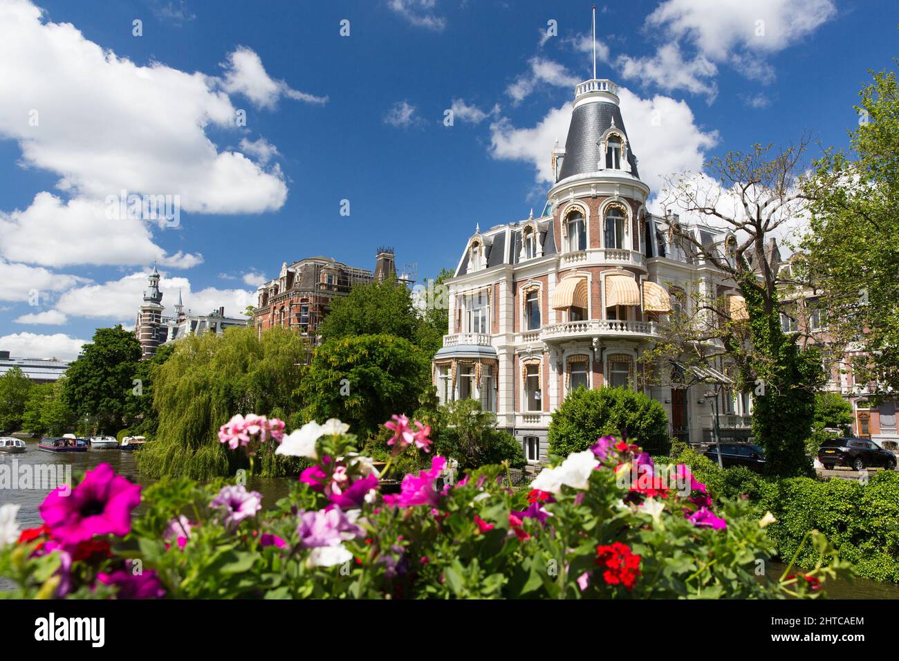 Beautiful view of modern buildings from a garden with flowers Stock ...