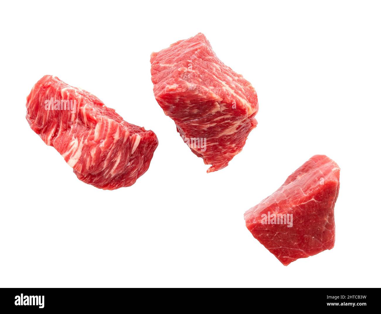 Three slices of raw beef meat isolated on white, clipping path Stock ...