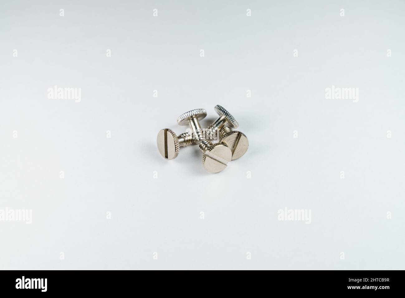 Top view of screws on a white background Stock Photo - Alamy