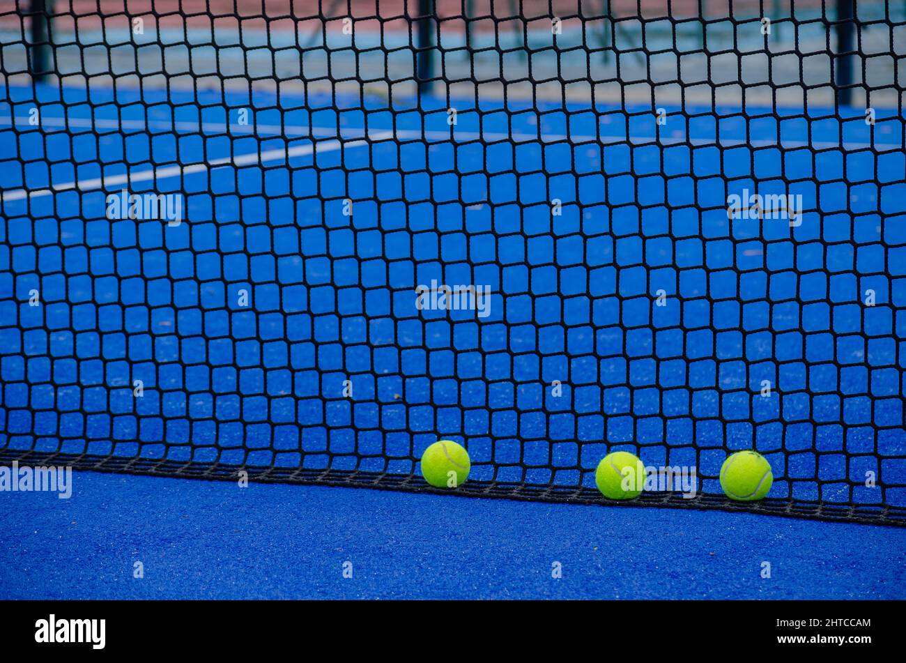 Closeup of three balls by the net in a tennis court Stock Photo - Alamy