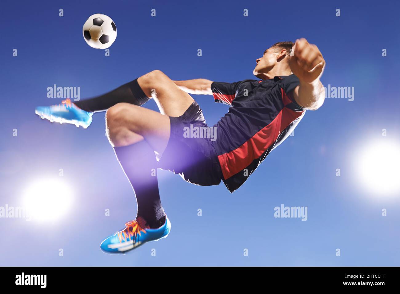 Someone Kicking A Soccer Ball In The Air