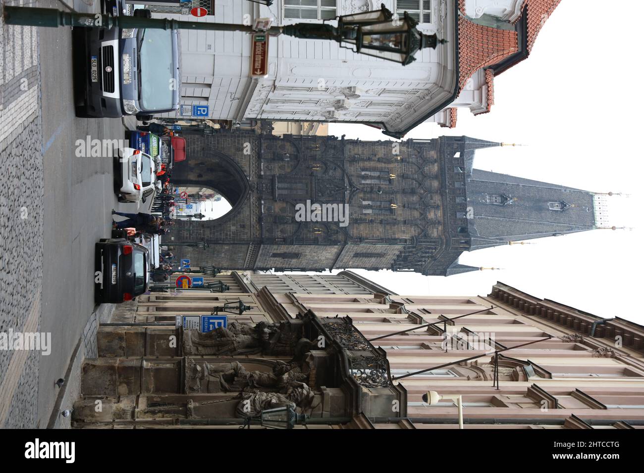Beautiful vertical view of the Old Town Bridge Tower with cars street ...