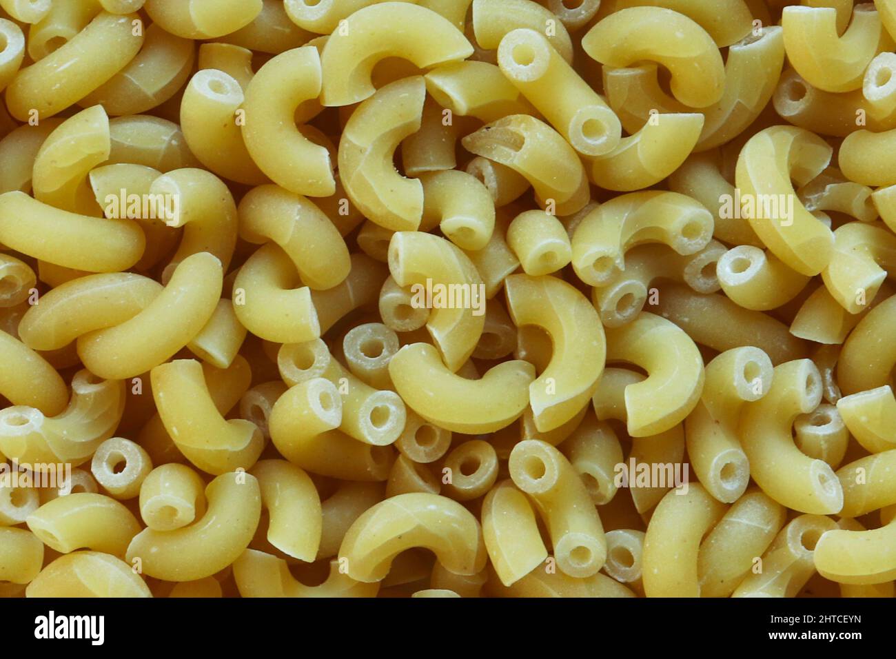 Closeup of elbow macaroni pattern for food background Stock Photo - Alamy