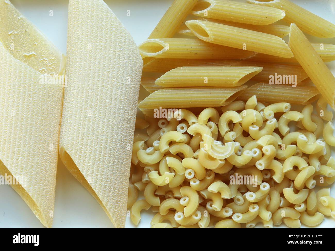 Closeup of different sizes of pasta for food background Stock Photo - Alamy