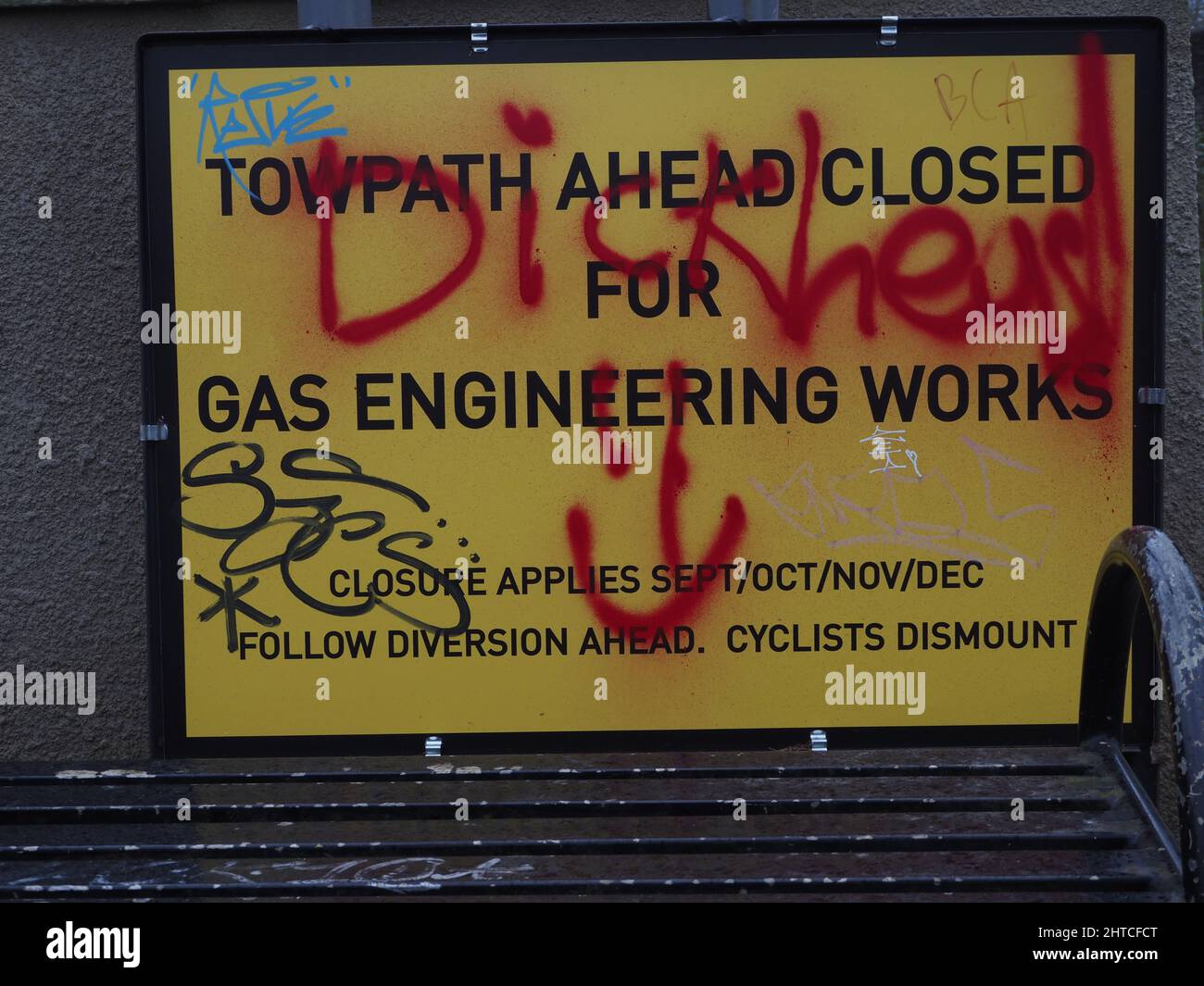 Graffitied sign, Locksbrook, Bath, Somerset, advising closure of River ...