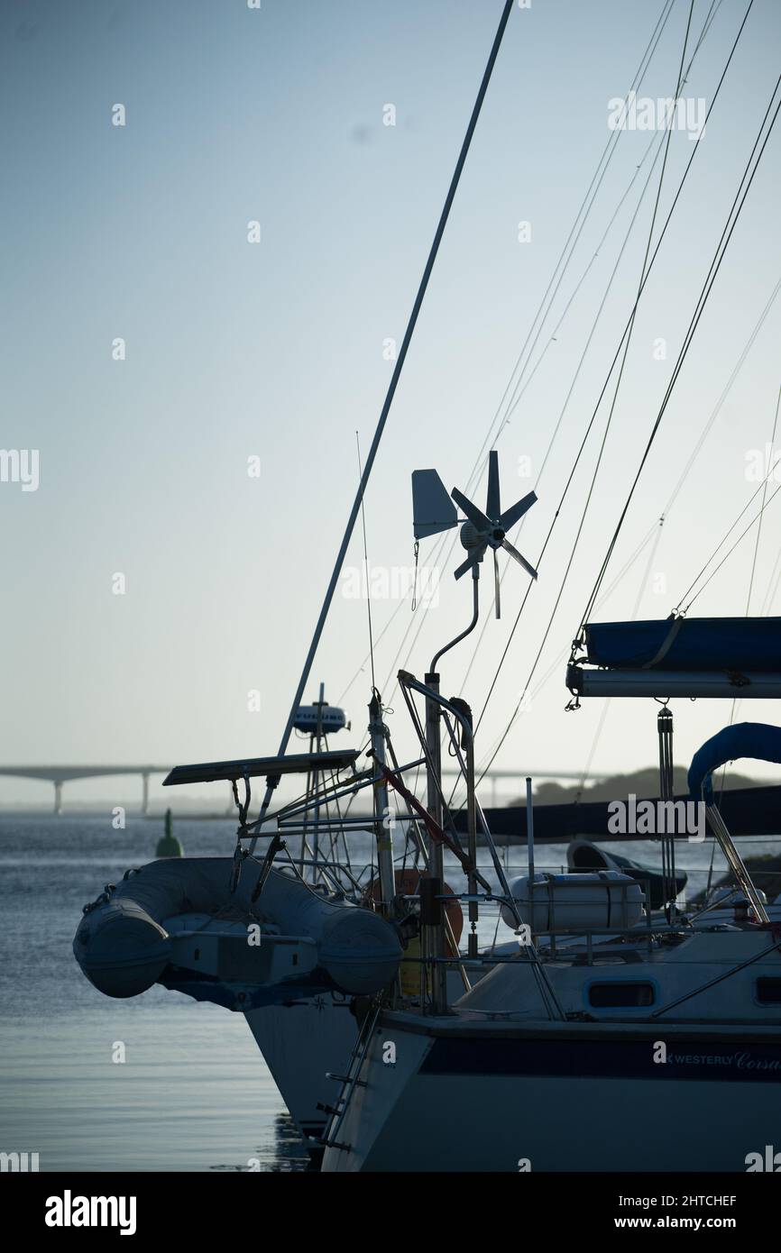 Vertical shot of a side part of a parked sailing yacht in the sunset ...