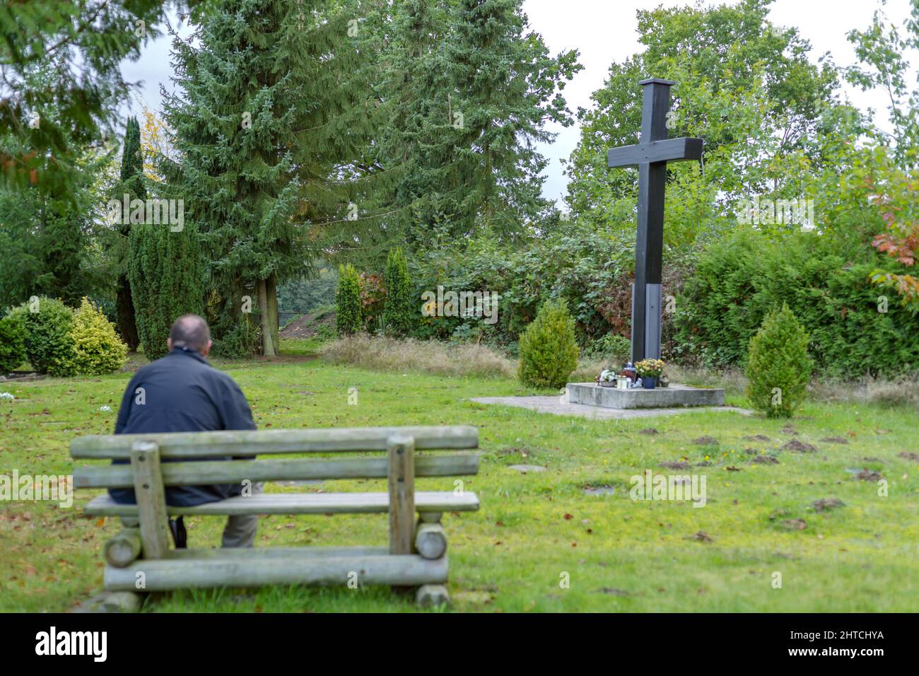 Man sitting in the chair after visiting his wife's grave Stock Photo ...