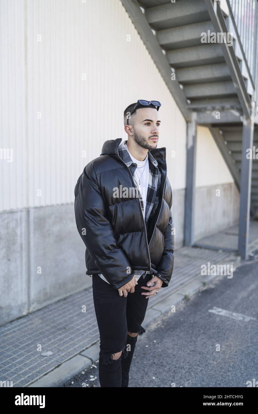 Vertical shot of a Caucasian man posing for a photo Stock Photo - Alamy