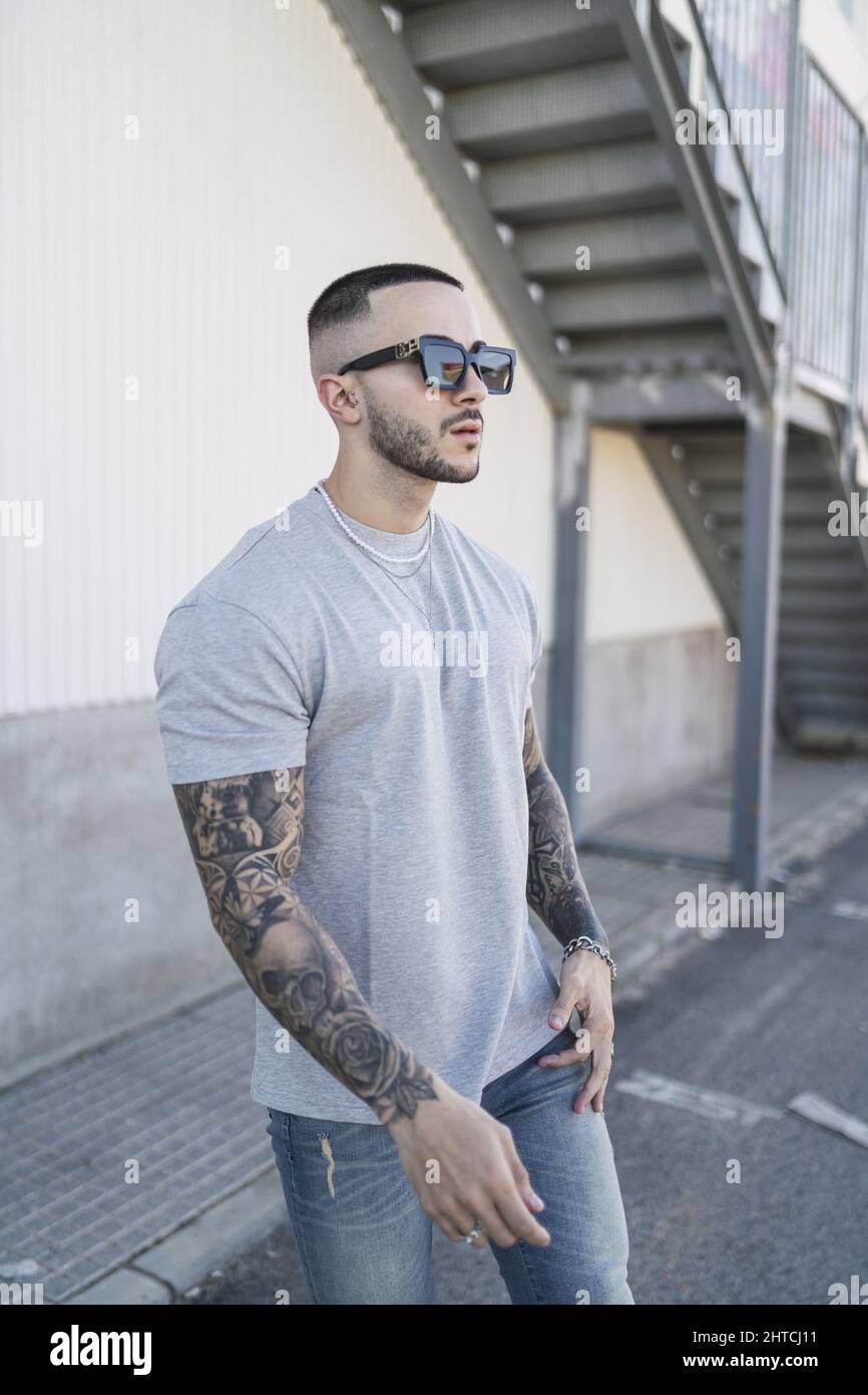 Vertical shot of a Caucasian man posing for a photo Stock Photo - Alamy