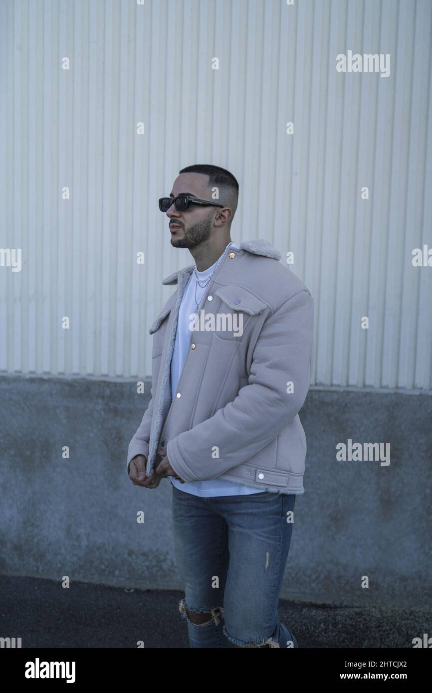 Vertical shot of a Caucasian man posing for a photo Stock Photo - Alamy