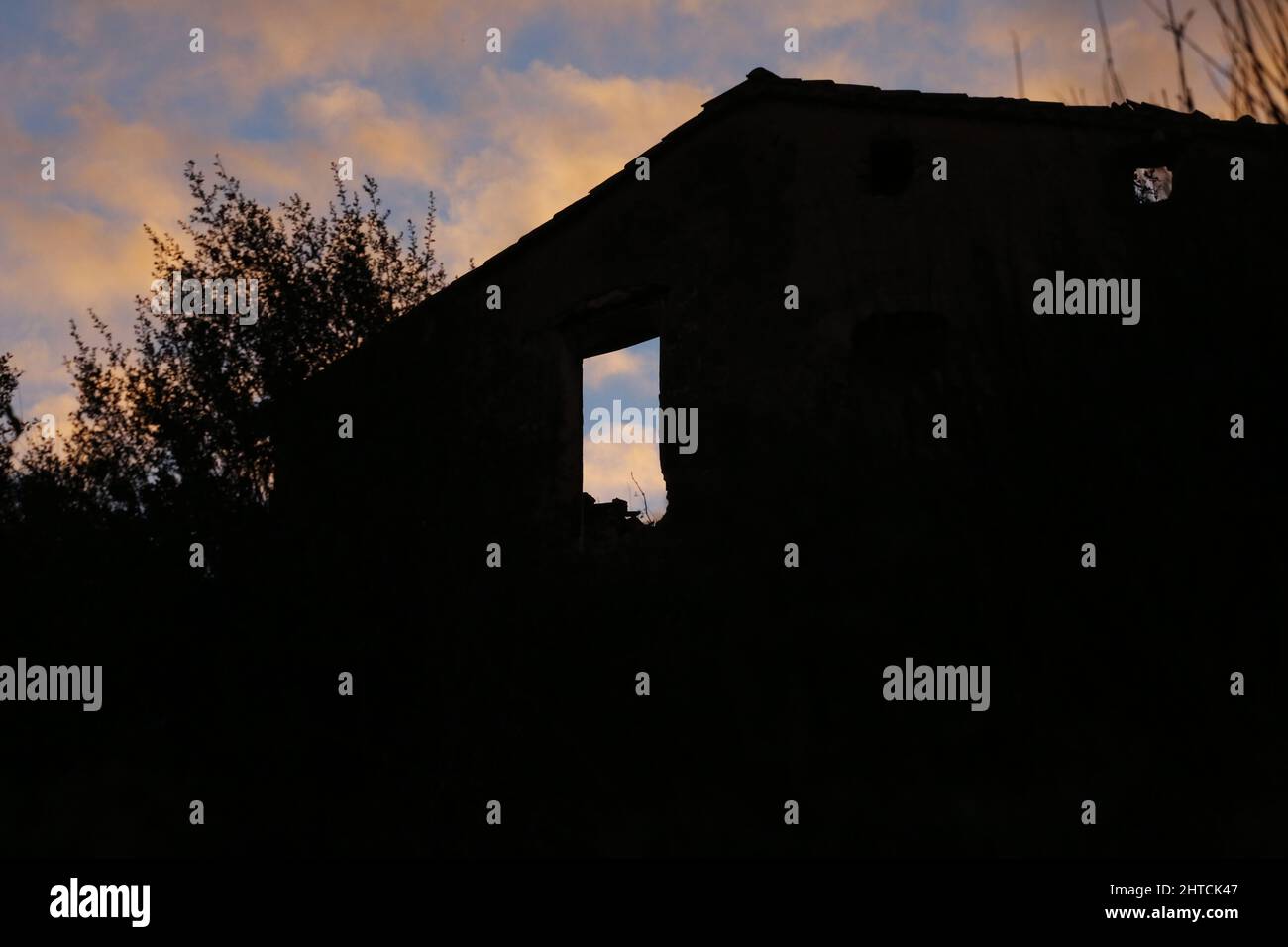 Beautiful view of a ruined building silhouette with cloudy sky ...