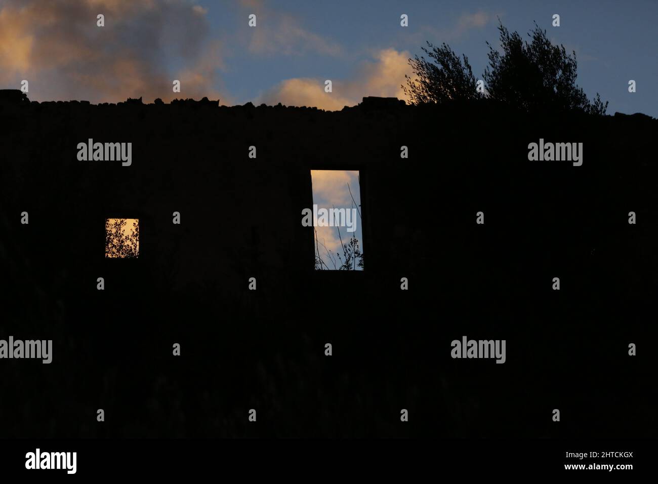 Beautiful view of a ruined building silhouette with cloudy sky ...