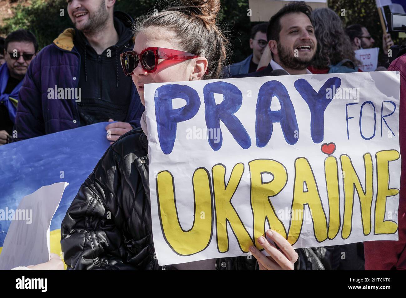 Jerusalem, Israel. 28th Feb, 2022. Protesters hold flags and placards ...