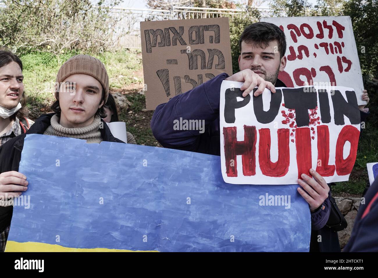 Jerusalem, Israel. 28th Feb, 2022. Protesters hold flags and placards ...