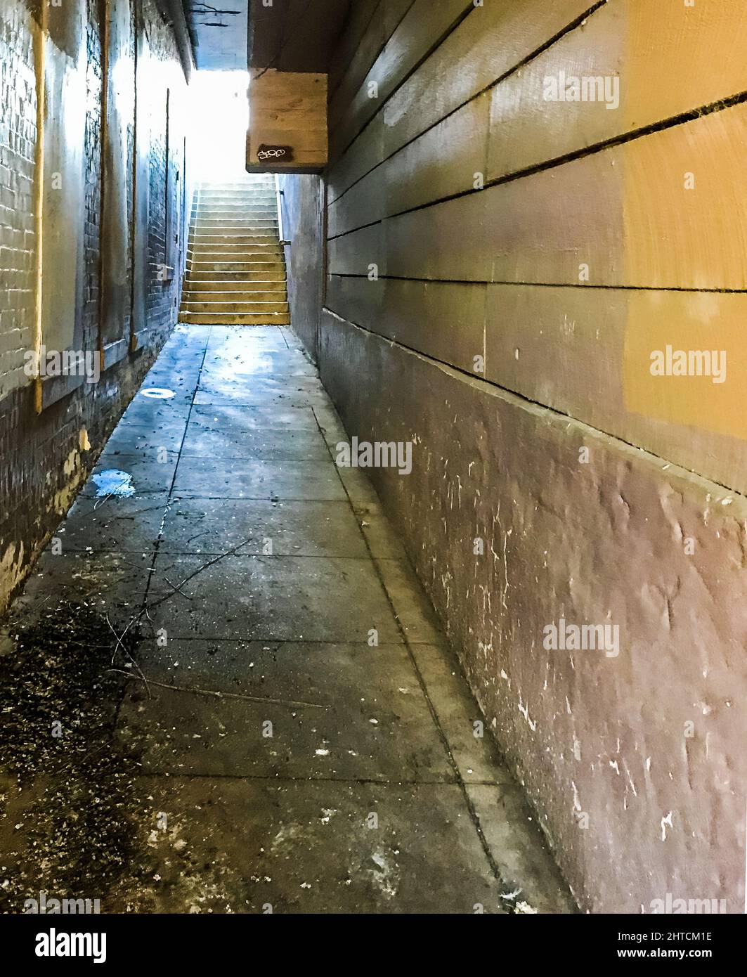 A dirty entrance with stairs in the background Stock Photo - Alamy