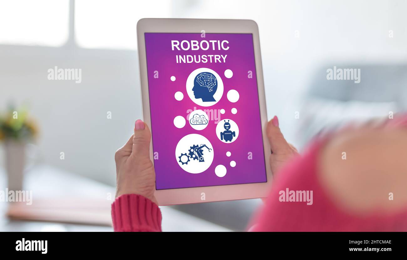 Tablet screen displaying a robotic industry concept Stock Photo - Alamy