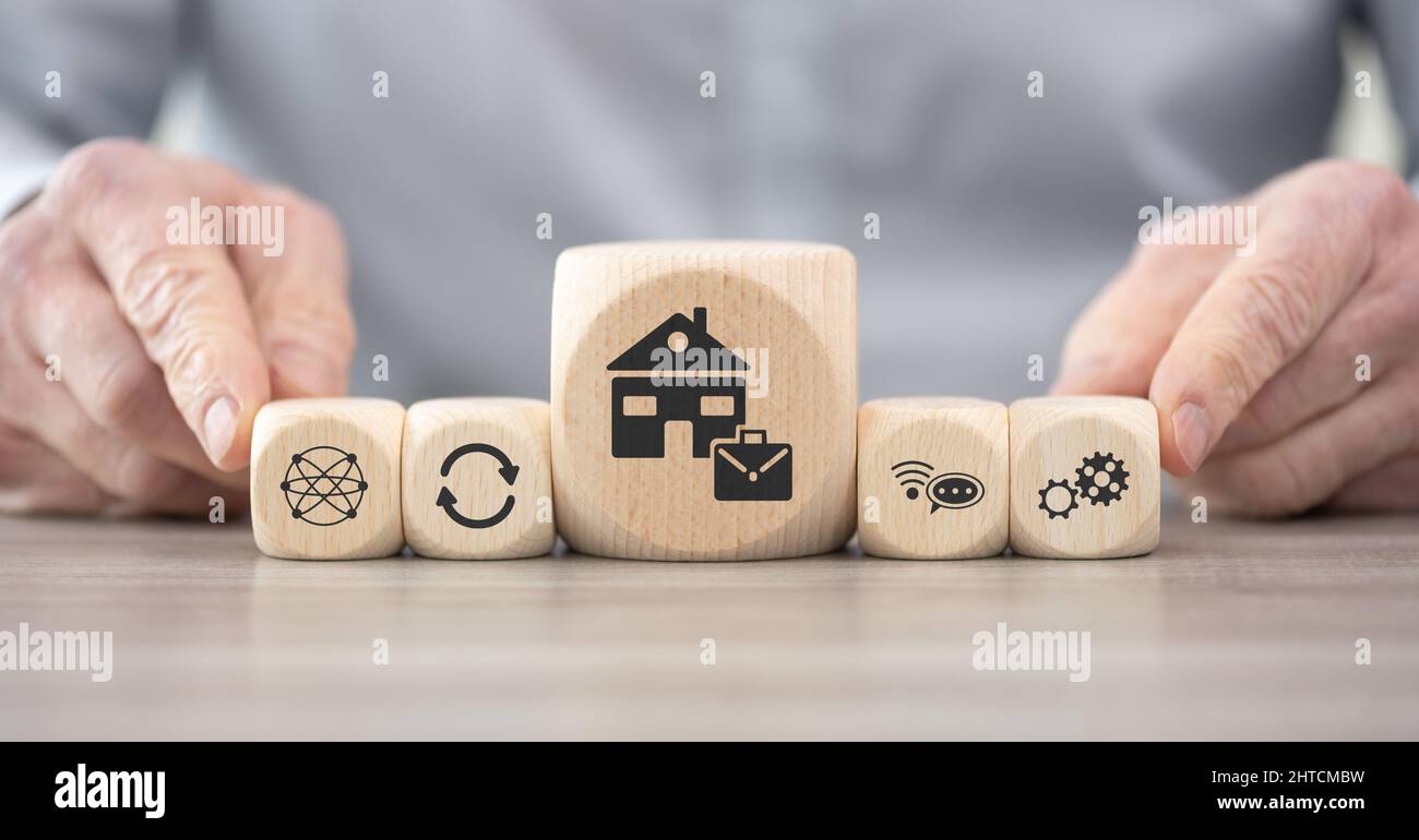 Wooden blocks with symbol of work from home concept Stock Photo - Alamy