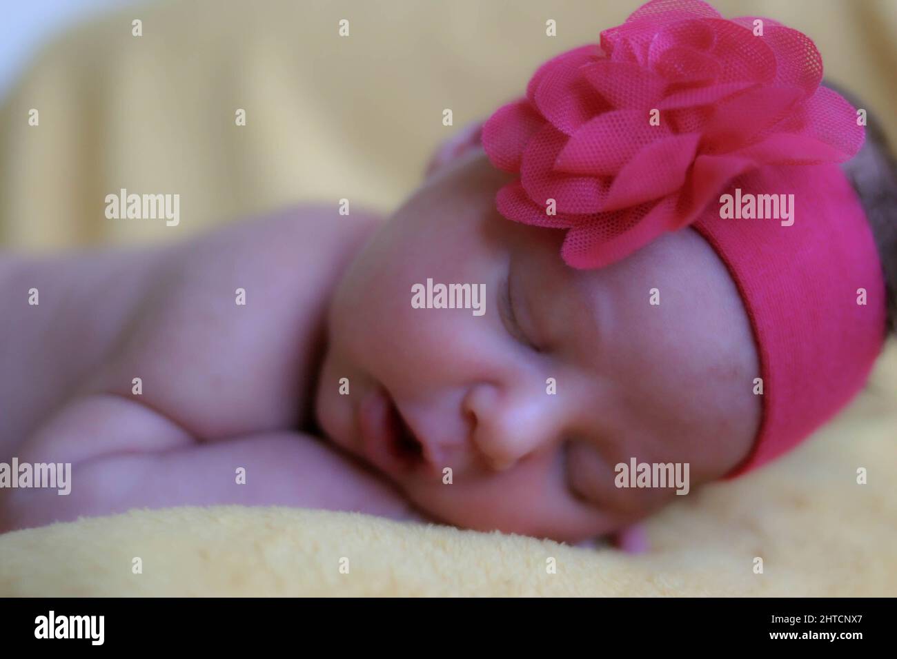 Adorable Caucasian newborn baby lying on a bed Stock Photo - Alamy