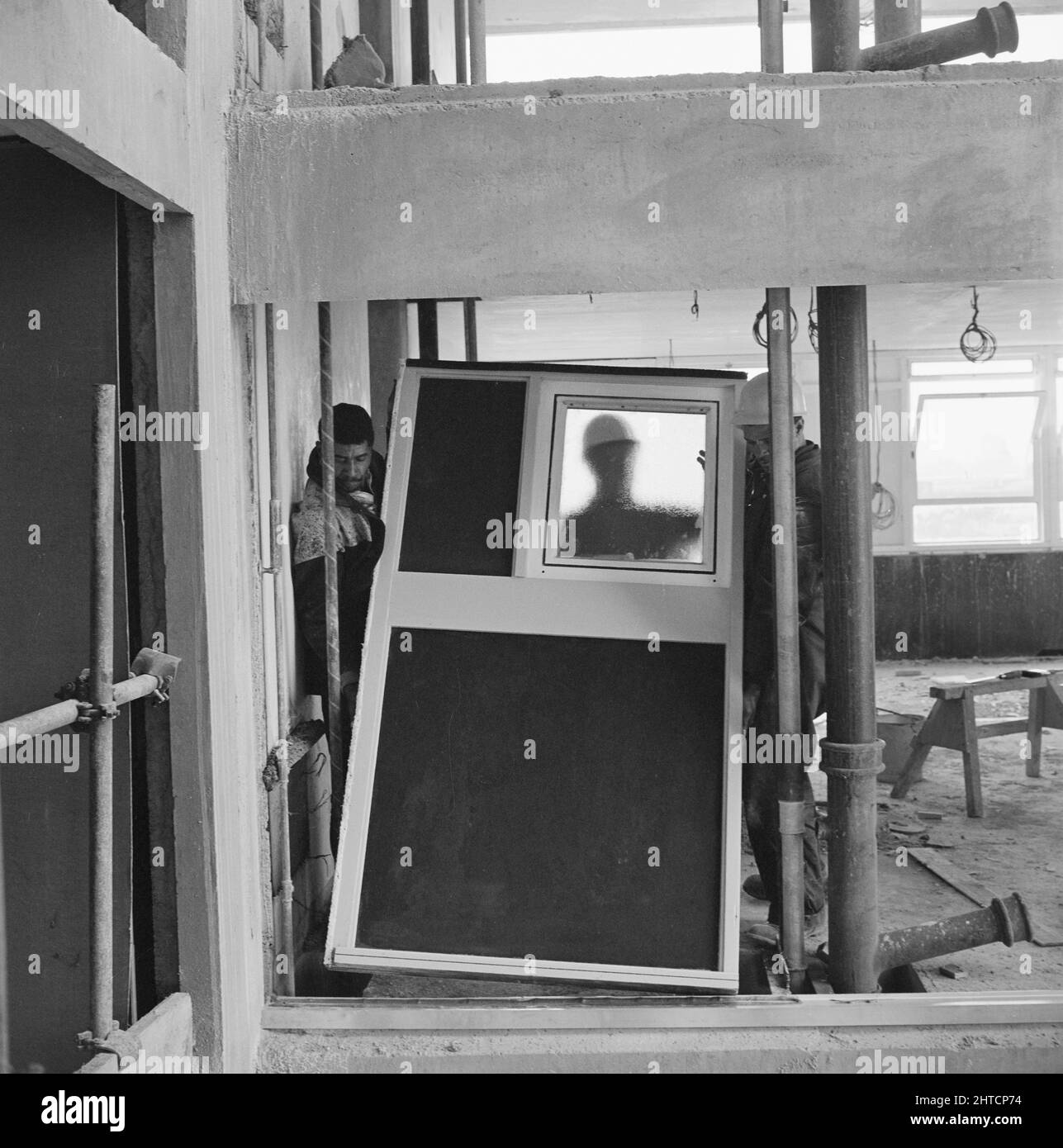Restell Close, Greenwich, London, 29/04/1966. Workers installing a ...