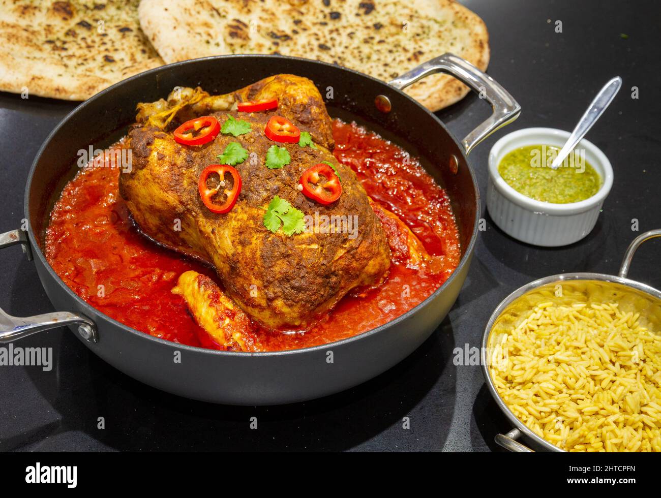 one-pot spiced roast chicken with accompaniments Stock Photo - Alamy