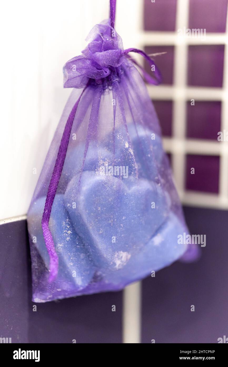 Purple heart-shaped objects in a purple transparent bag Stock Photo - Alamy