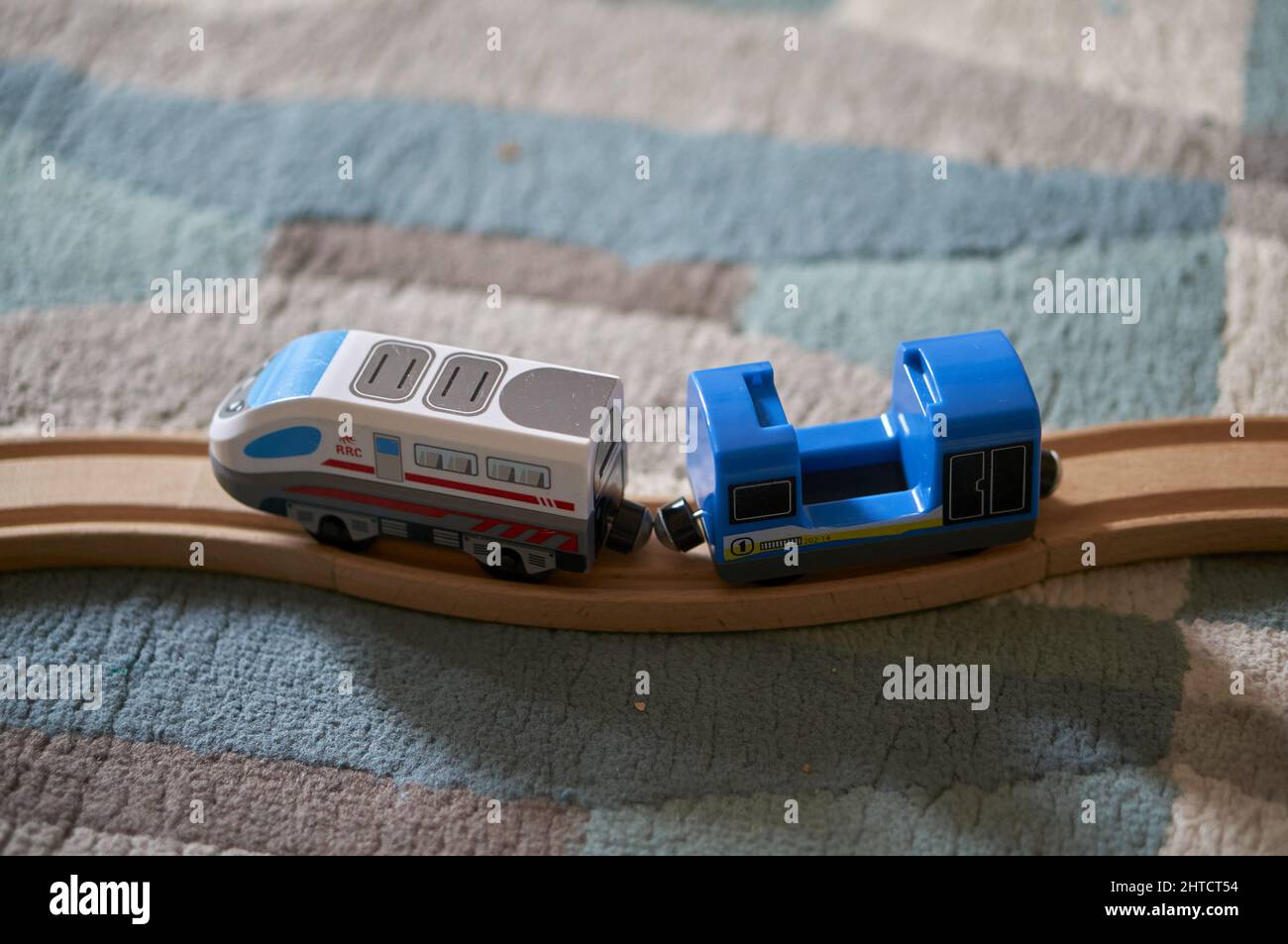 Plastic toy train on track Stock Photo - Alamy
