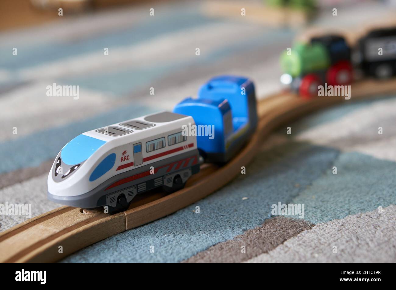 Plastic toy train on track Stock Photo - Alamy
