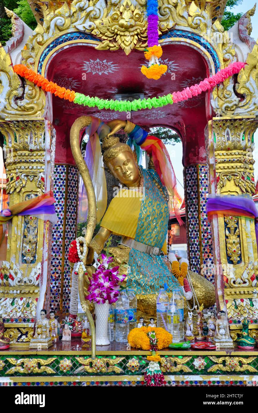 Mythic Buddhist figure of Phra Mae Thorani wringing water out of her ...