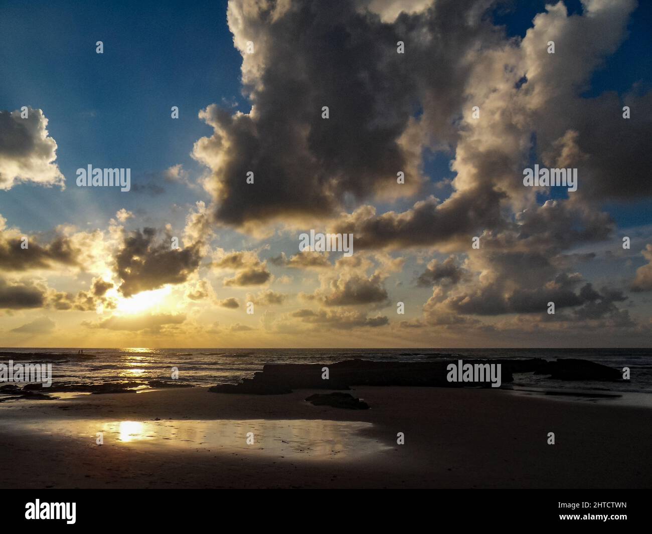 Scenic view of the Monte Clerigo Beach in Algarve, Portugal at sunset ...
