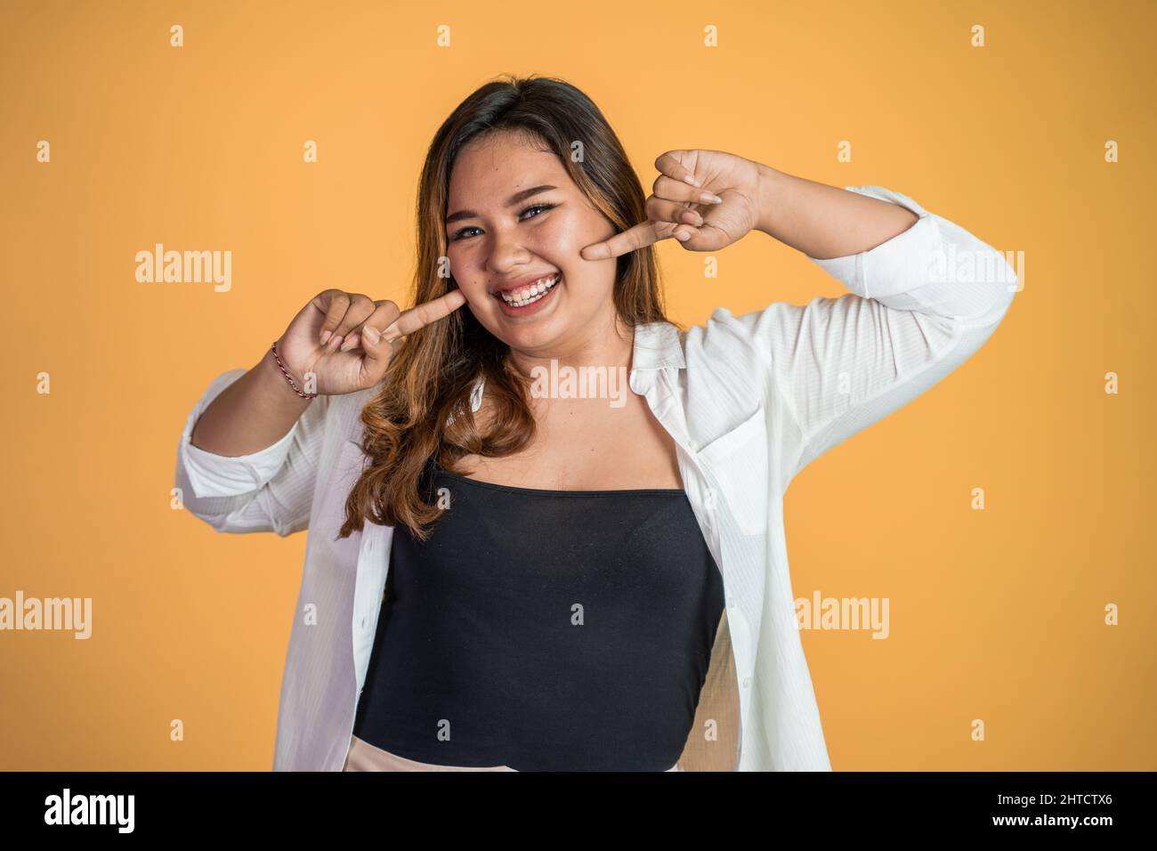 confident young asian woman portrait smiling to camera Stock Photo - Alamy