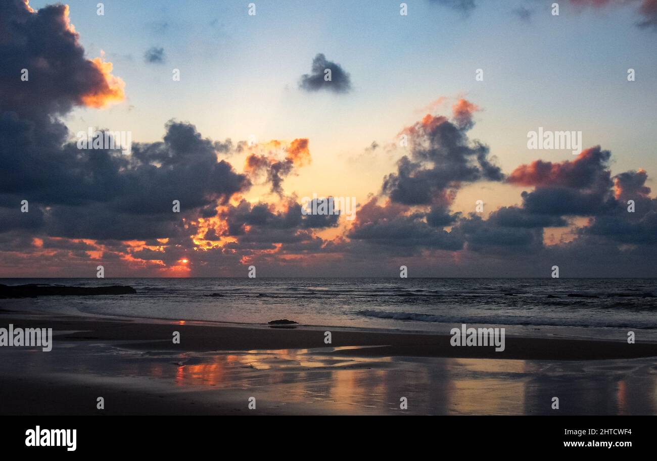 Scenic view of the Monte Clerigo Beach in Algarve, Portugal at sunset ...