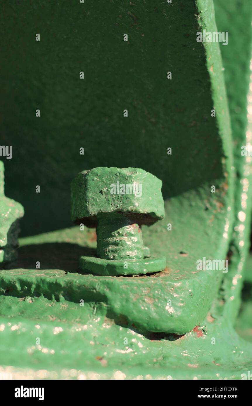A loose nut and bolt steel connection on an old tractor machine Stock ...