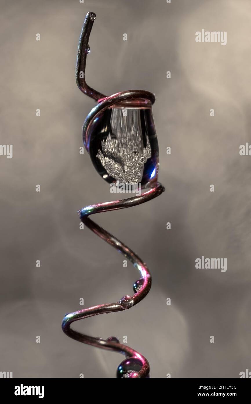 Vertical closeup picture of a metallic DNA-like metal Stock Photo - Alamy