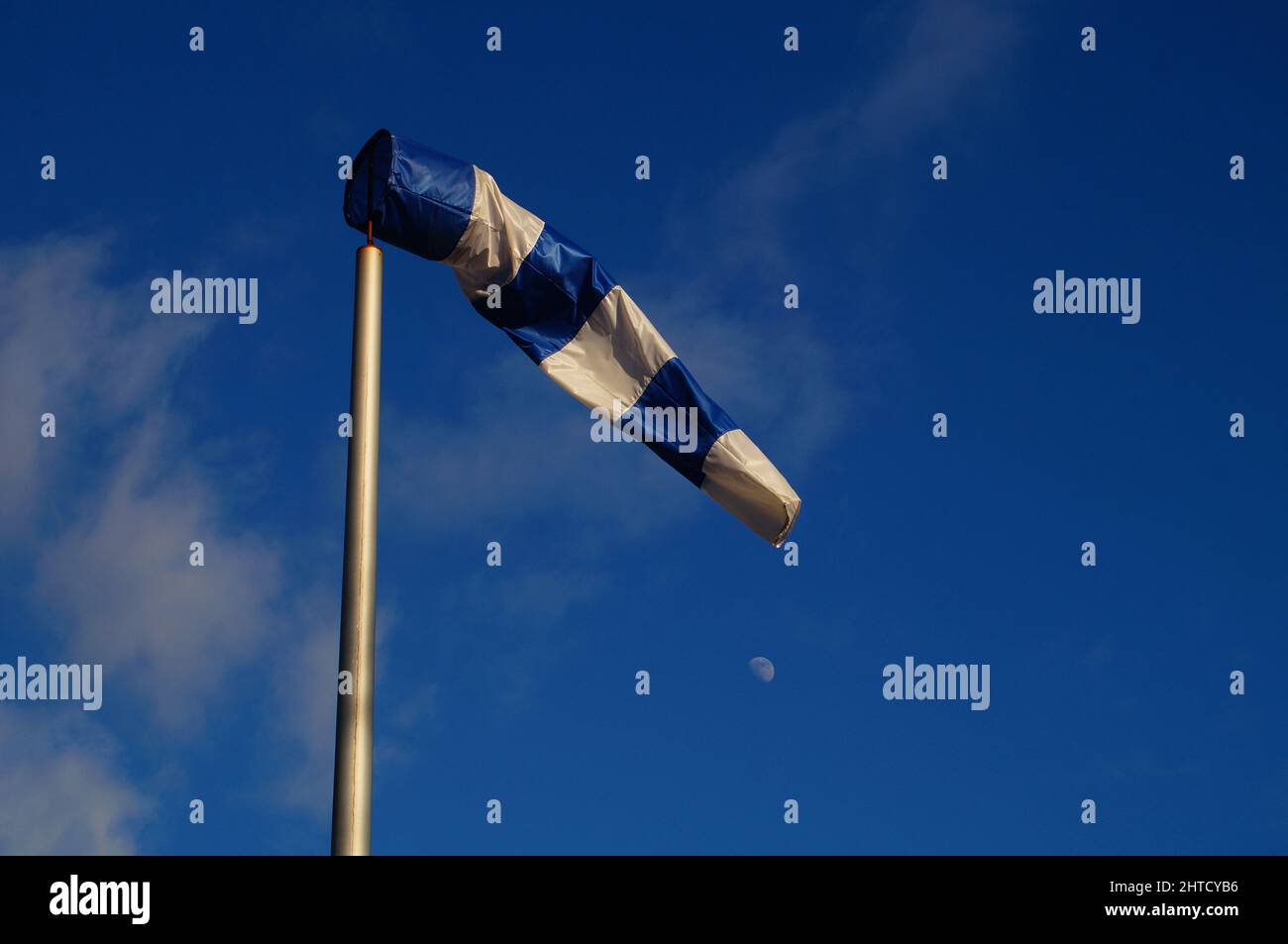 A blue windsock at the old airfield Frankfurt-Bonames against the blue ...