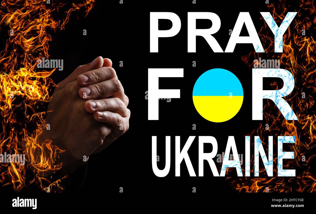 Pray for Ukraine message with a hand in prayer and the Ukrainian flag ...