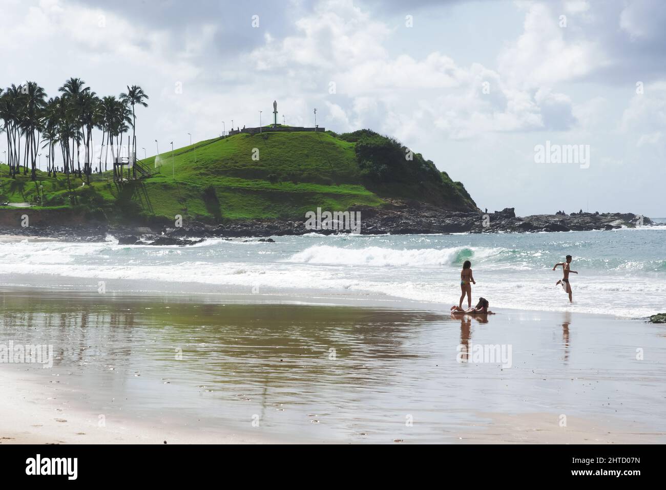 Morro do Cristo grassy mound by the sea, with a famous statue of Jesus ...
