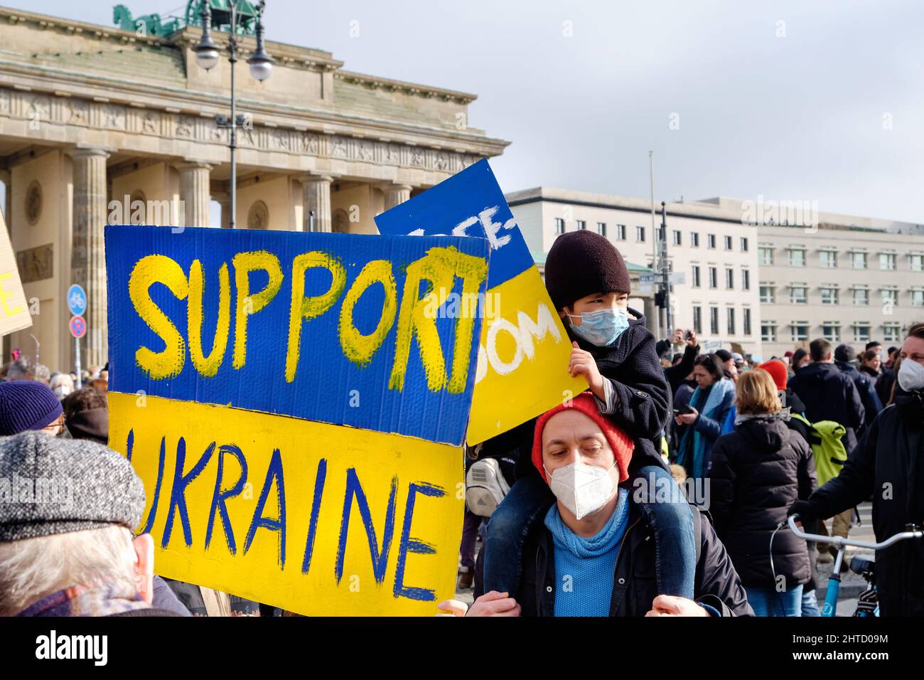 Banner with text Support Ukraine. People with yellow blue flags and ...