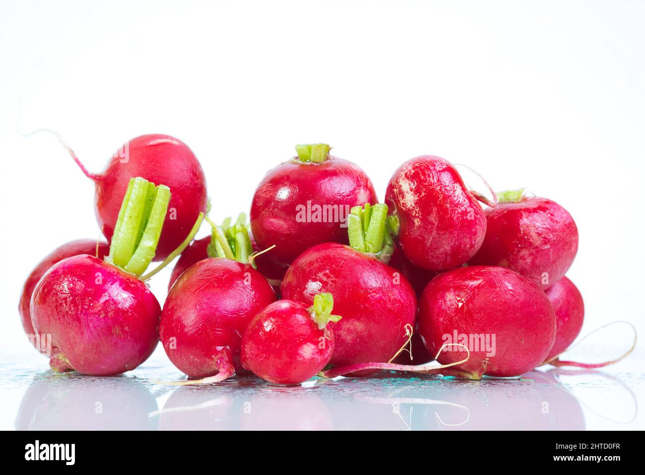 fresh radishes on white background Stock Photo - Alamy