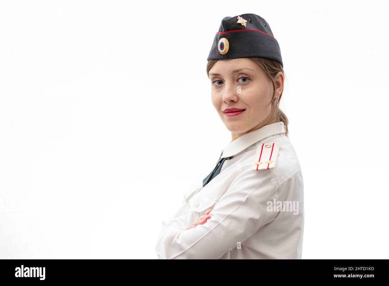 A beautiful young female Russian police officer in dress uniform in a ...