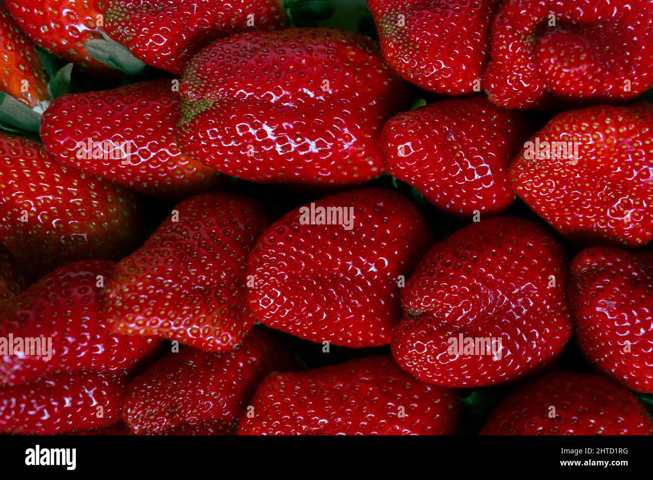 Close up of fresh strawberries texture in dark mood photo style Stock ...