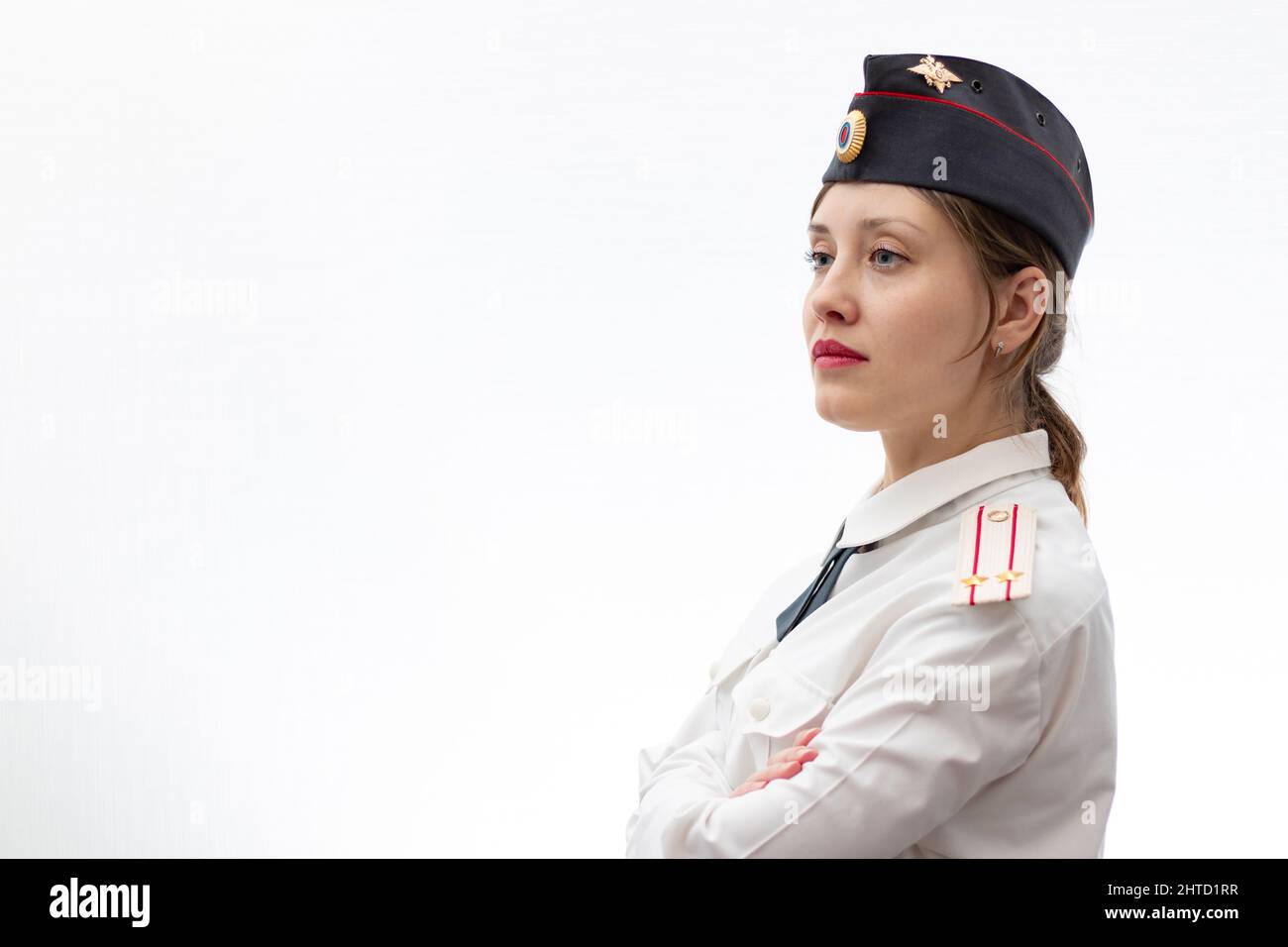 A beautiful young female Russian police officer in dress uniform in a ...