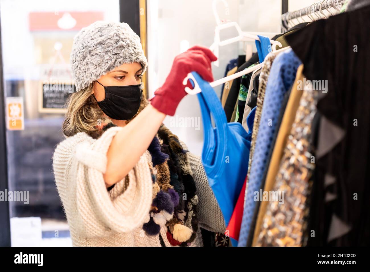 Young lady shopping at a clothing store Stock Photo - Alamy