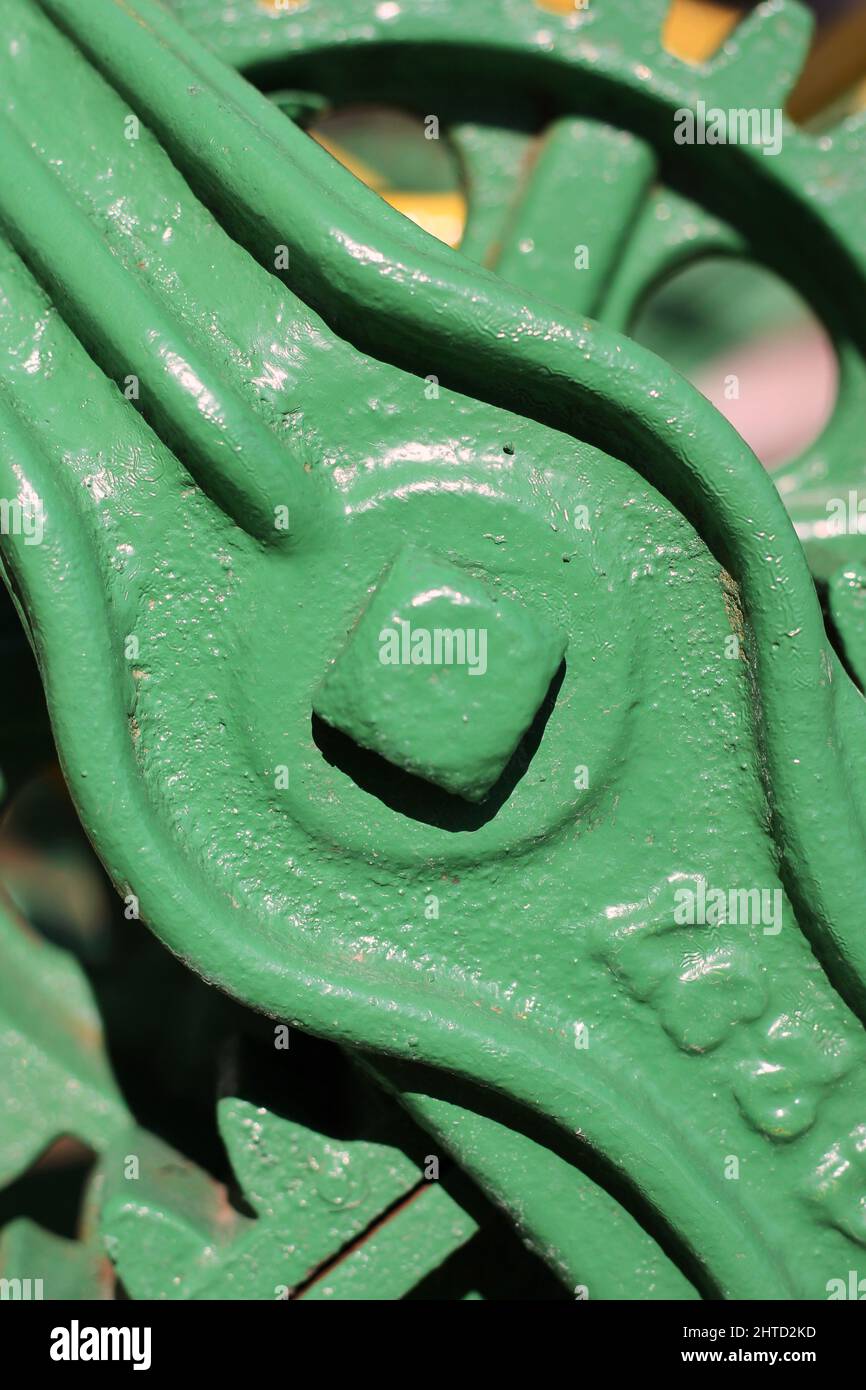 A rotating nut and bolt steel connection on an old tractor machine ...