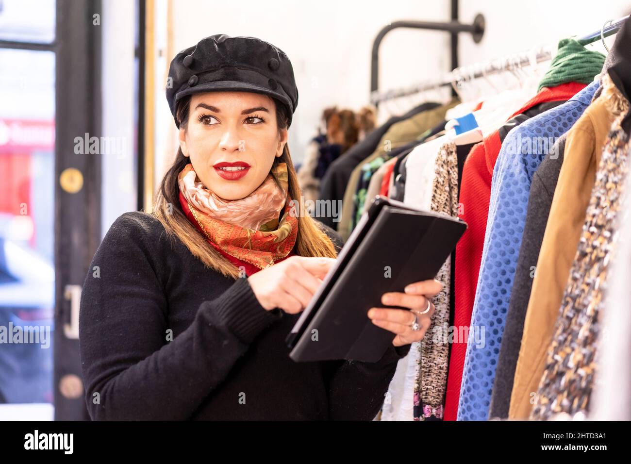 Woman shop assistant with a tablet Stock Photo - Alamy