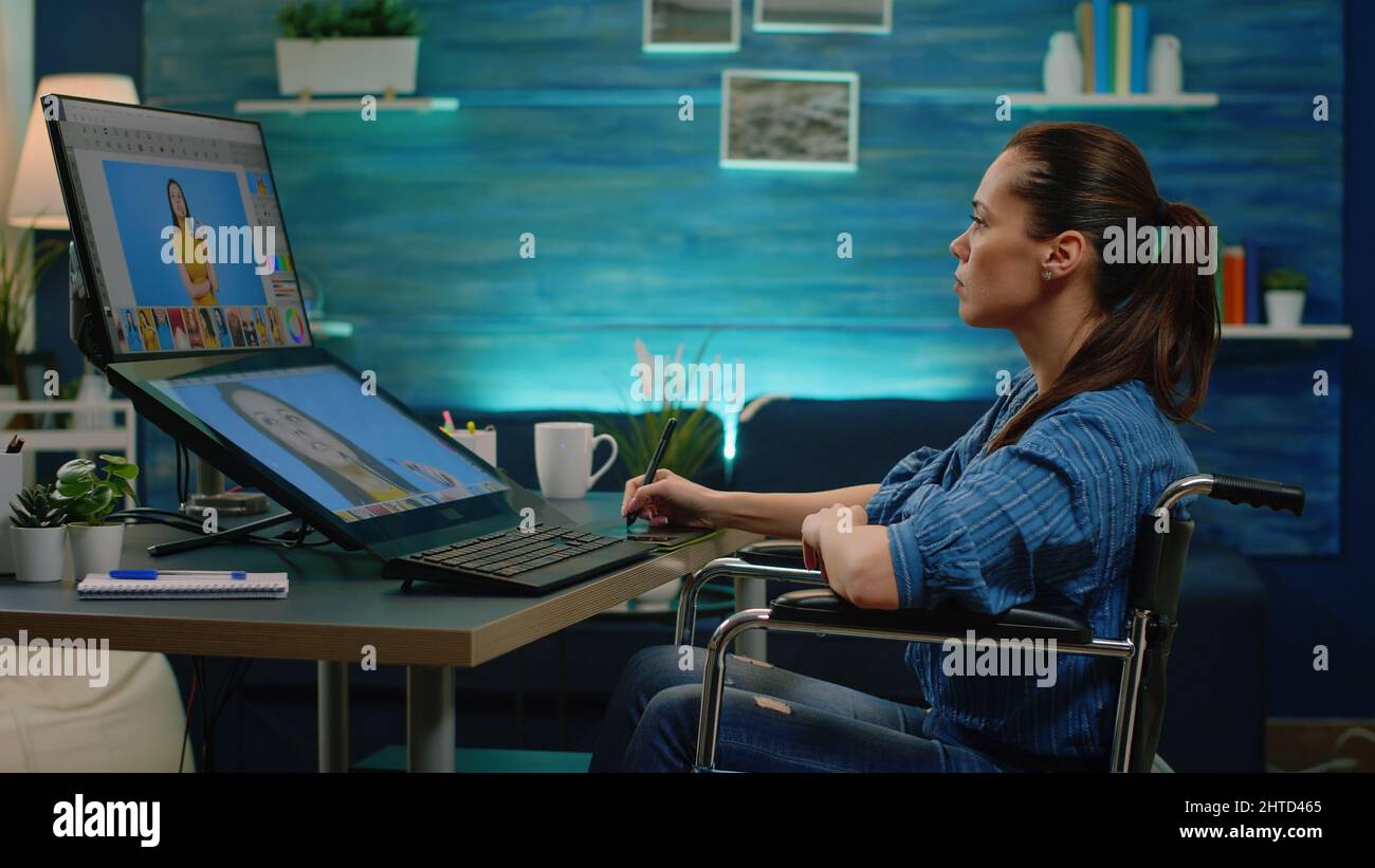 Disabled editor doing retouch work with editing software on touch ...