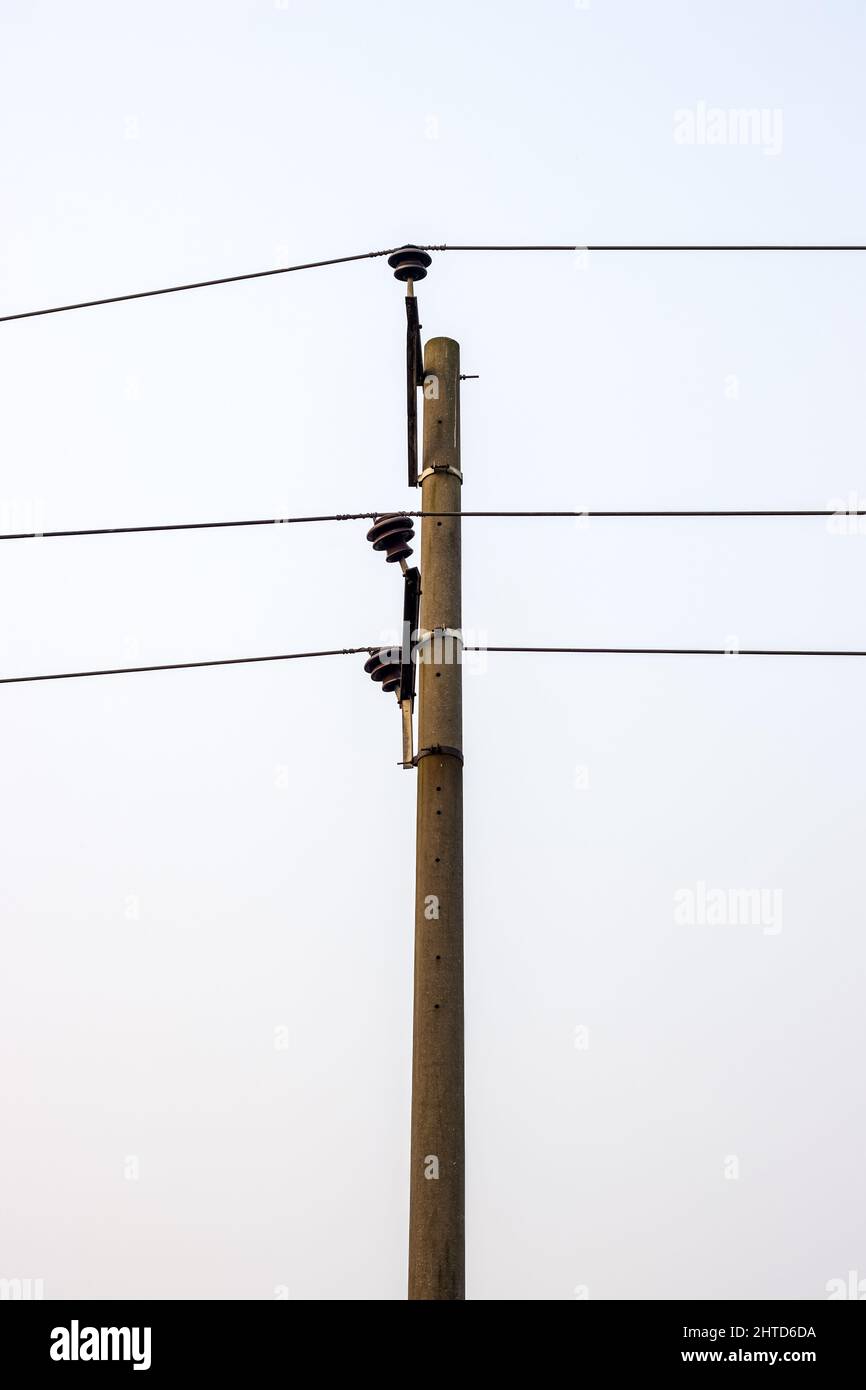 Vertical shot of electricity transmission pole in the urban area Stock ...